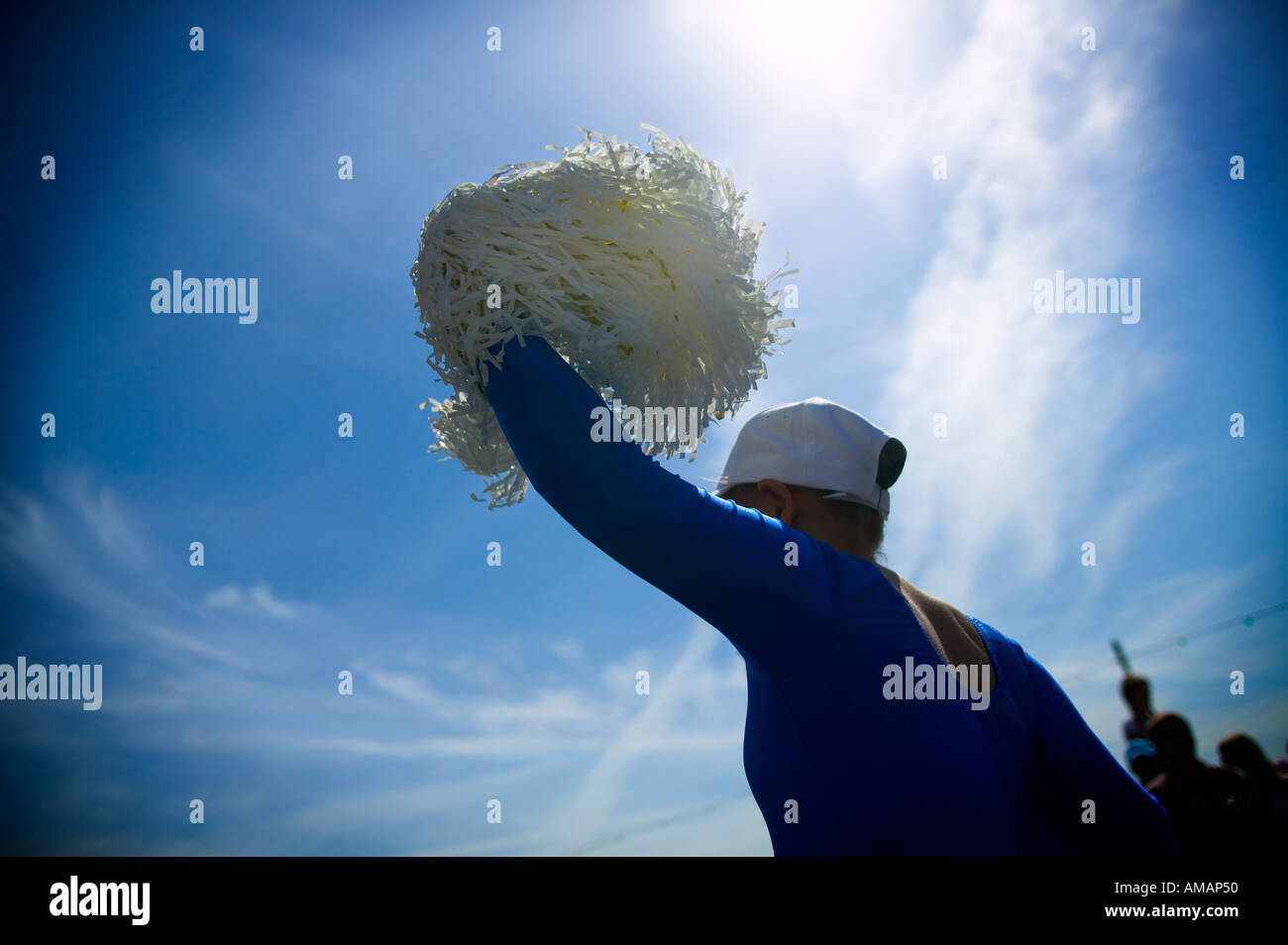 Cheerleader waving pom pom during the Battle of Flowers parade in ...