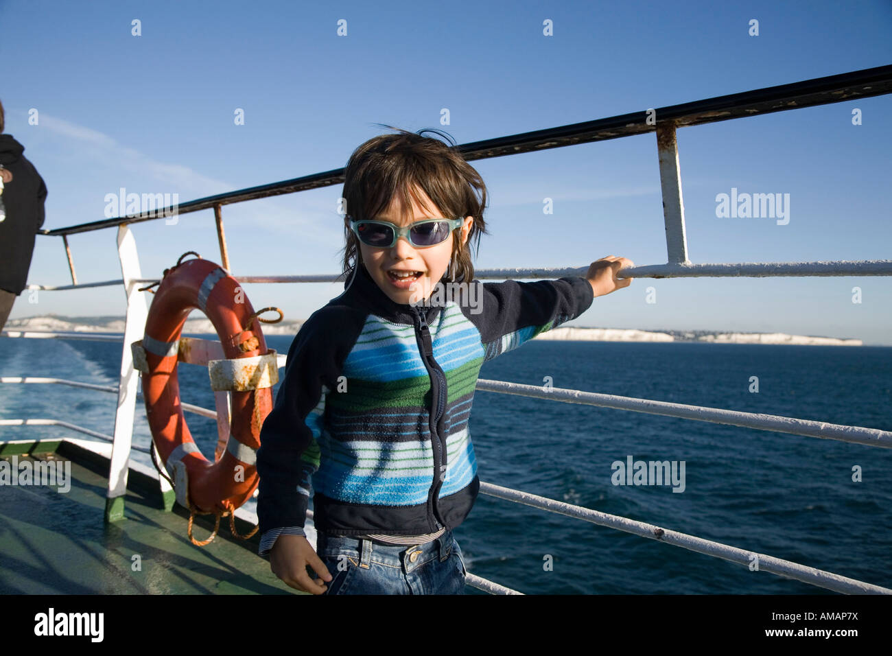 A young boy on a boat deck Stock Photo - Alamy