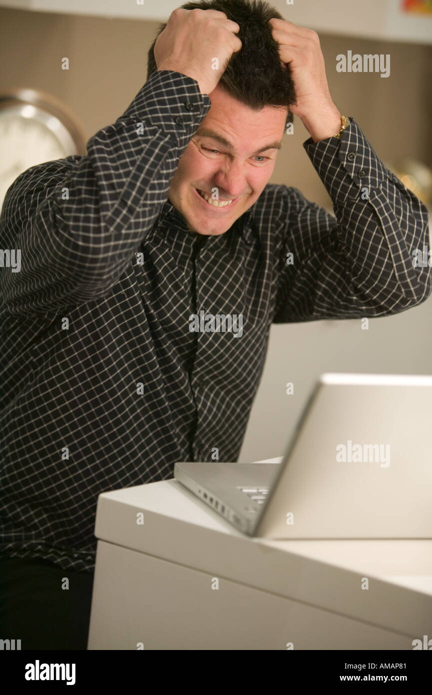 Frustrated computer worker causcasian male late 40s Stock Photo - Alamy