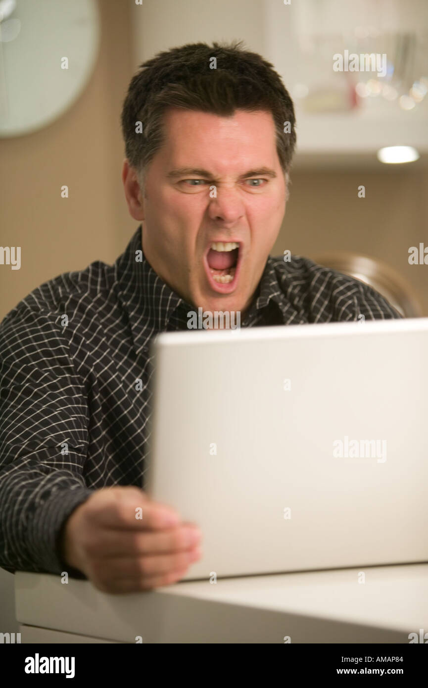 Frustrated computer worker causcasian male late 40s Stock Photo - Alamy