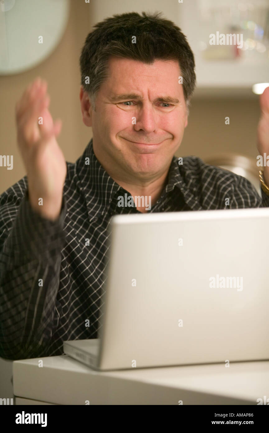 Frustrated computer worker causcasian male late 40s Stock Photo - Alamy