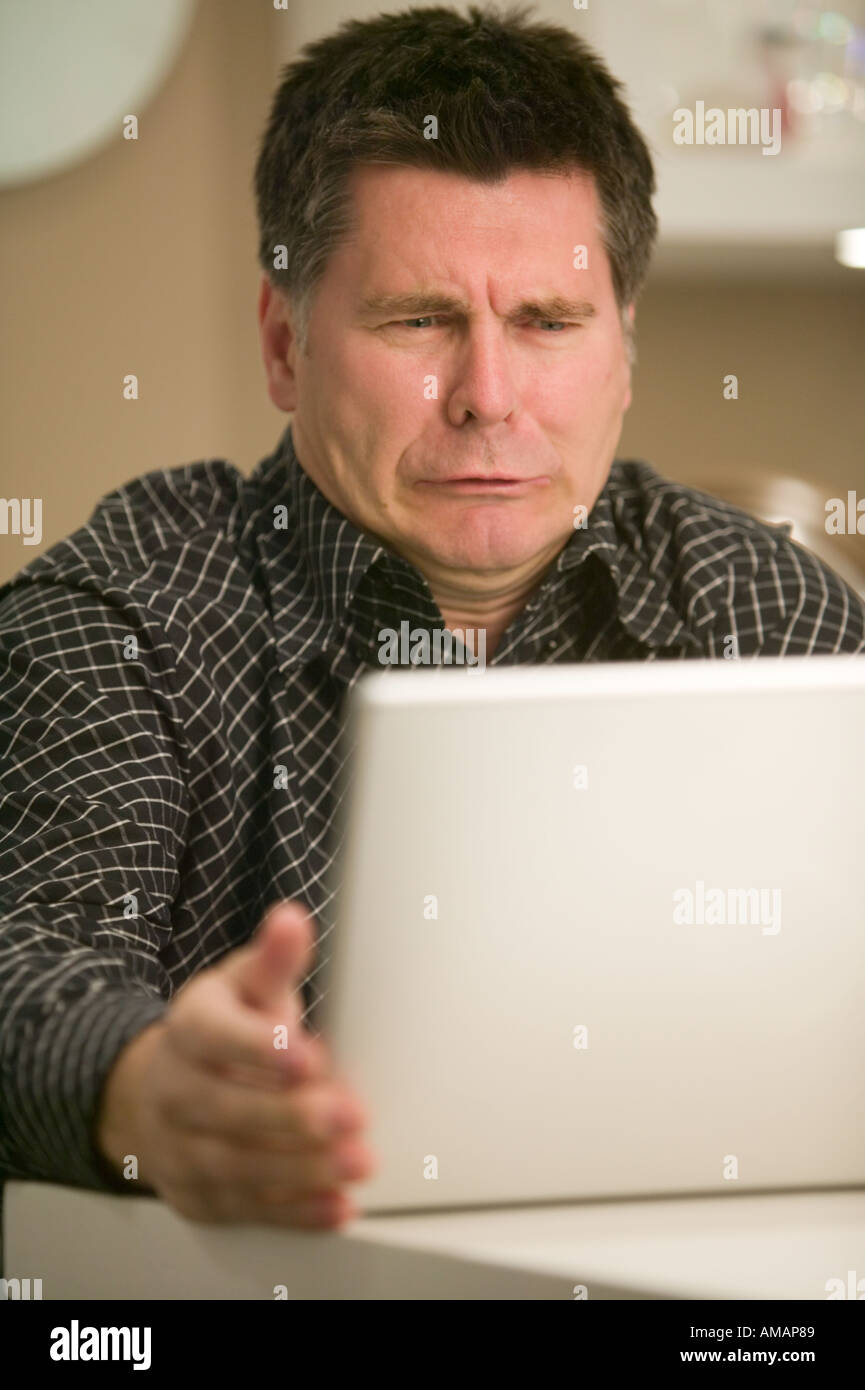 Frustrated computer worker causcasian male late 40s Stock Photo - Alamy