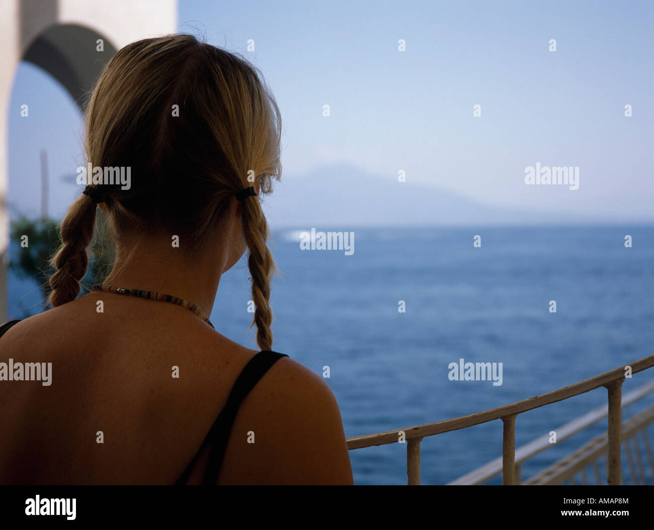 A woman looking out to sea Stock Photo - Alamy