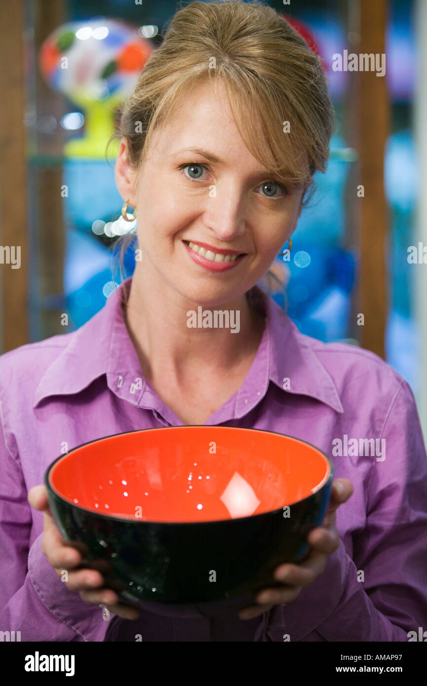 caucasian female mid 40s showing bowl Stock Photo - Alamy