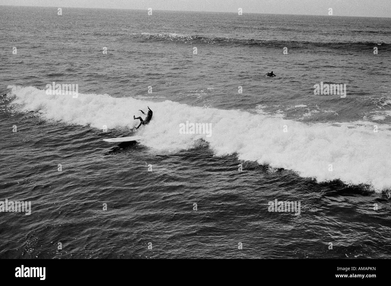 Surfer falling off surfboard Black and White Stock Photos & Images - Alamy