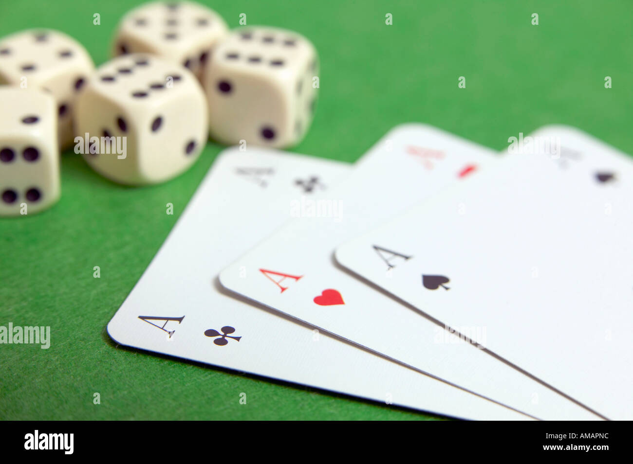 Dice and three aces, close-up Stock Photo - Alamy