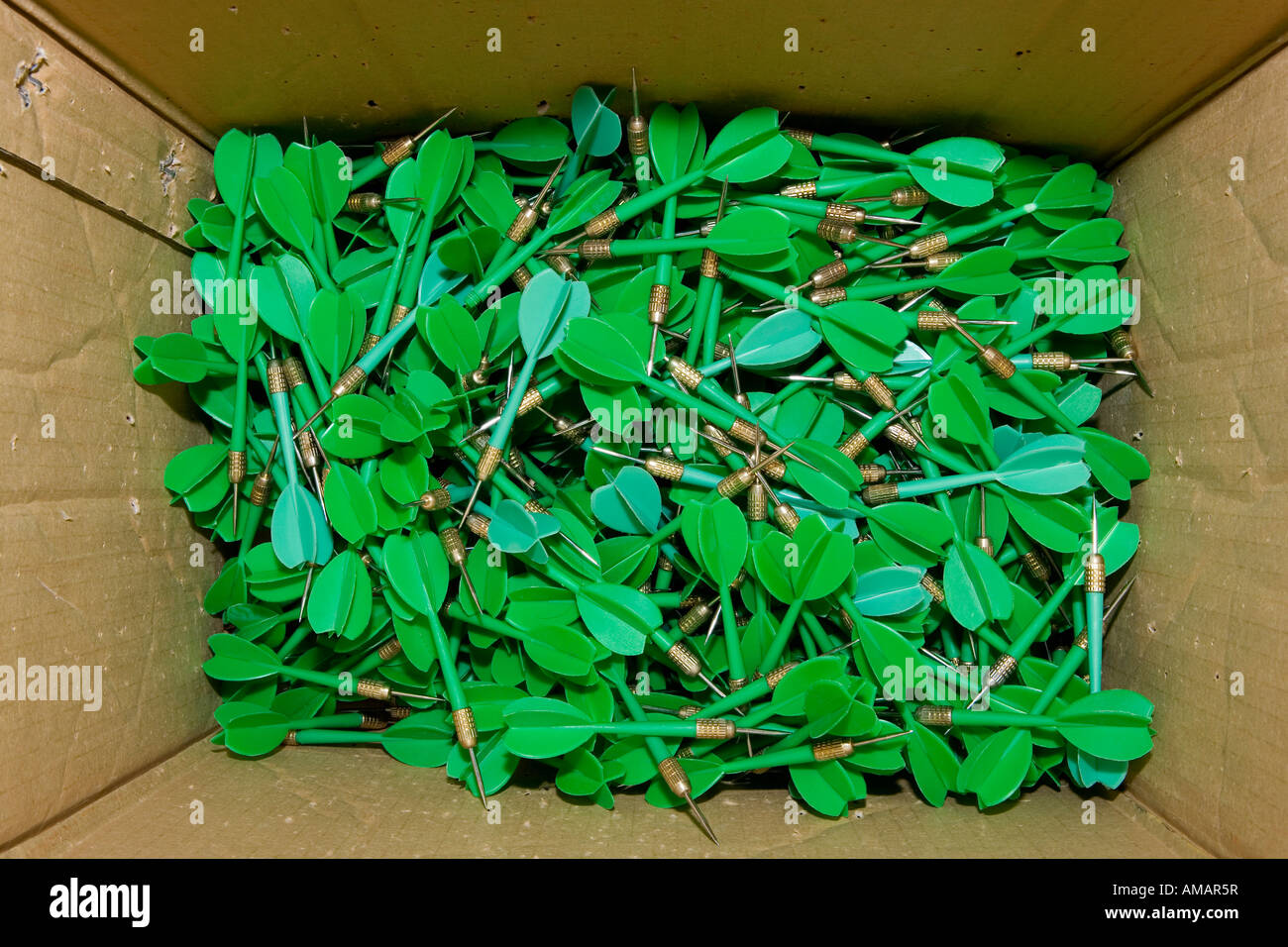 Green darts in a box Stock Photo - Alamy