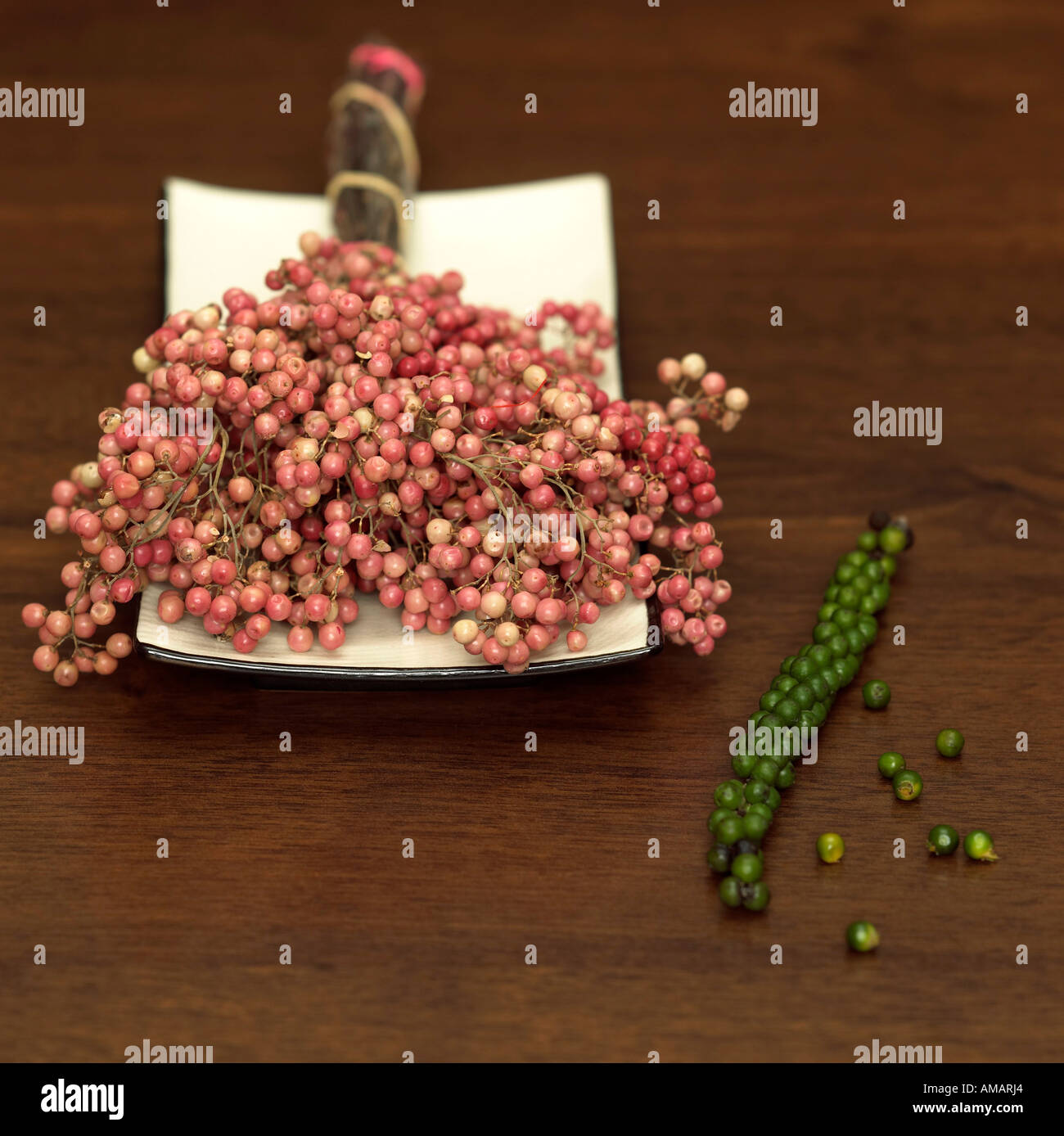 Fresh green and red peppercorns, elevated view Stock Photo - Alamy