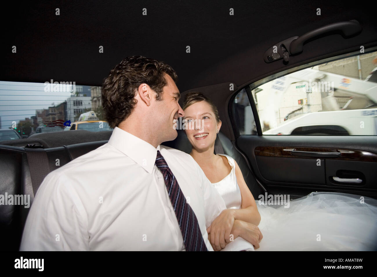A bride and groom in a car Stock Photo - Alamy