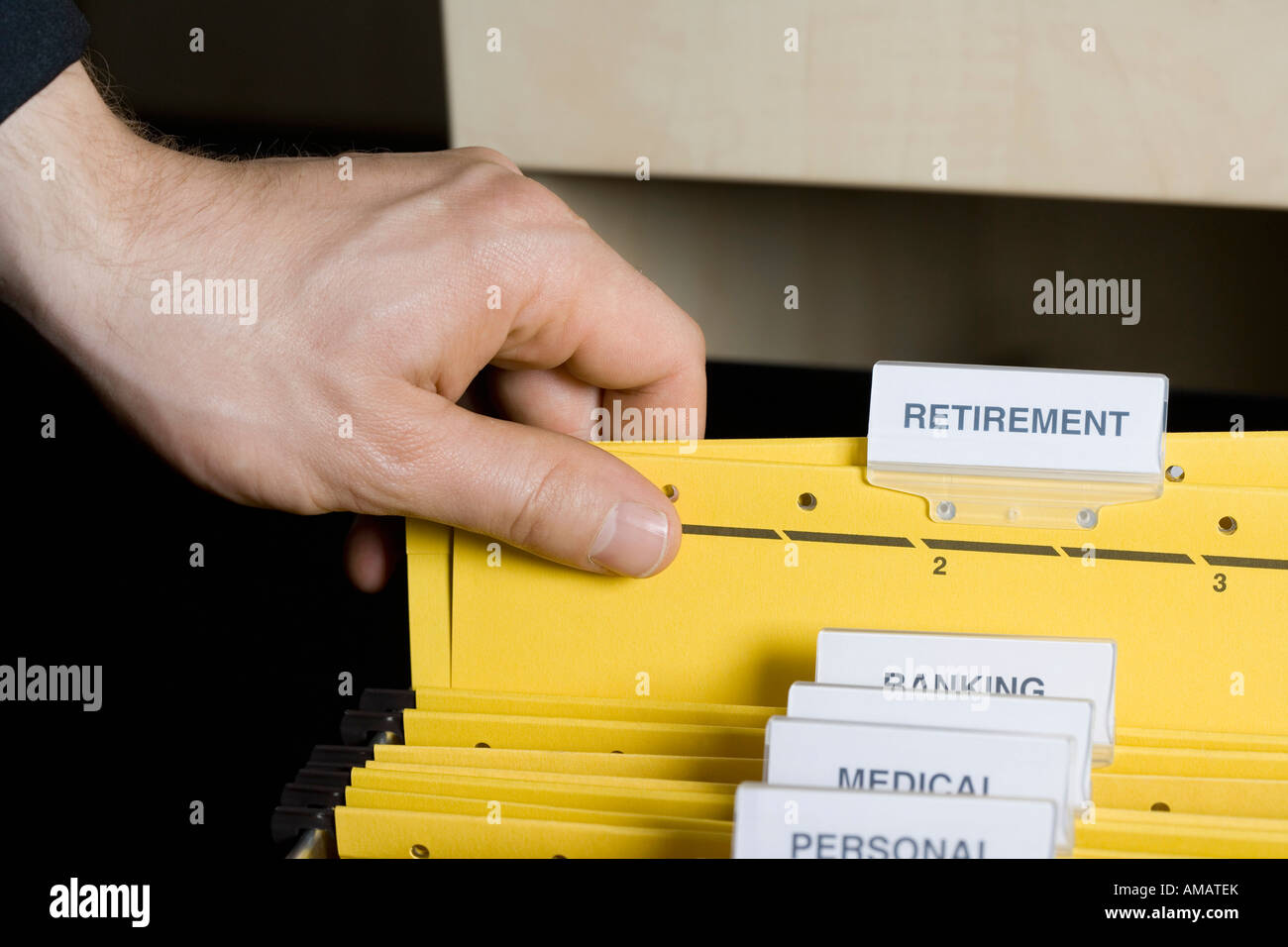 A hand picking up a file Stock Photo - Alamy