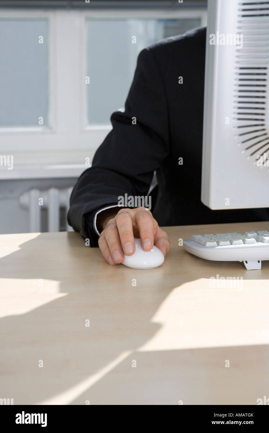 A man working behind a computer Stock Photo - Alamy