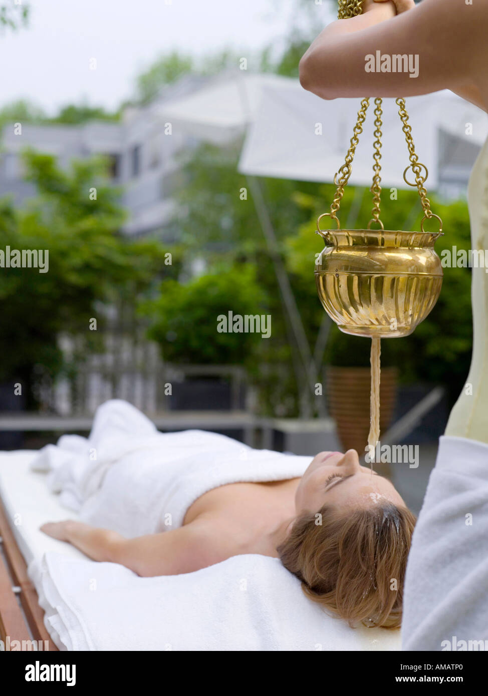 Woman pouring oil hair hi-res stock photography and images - Alamy