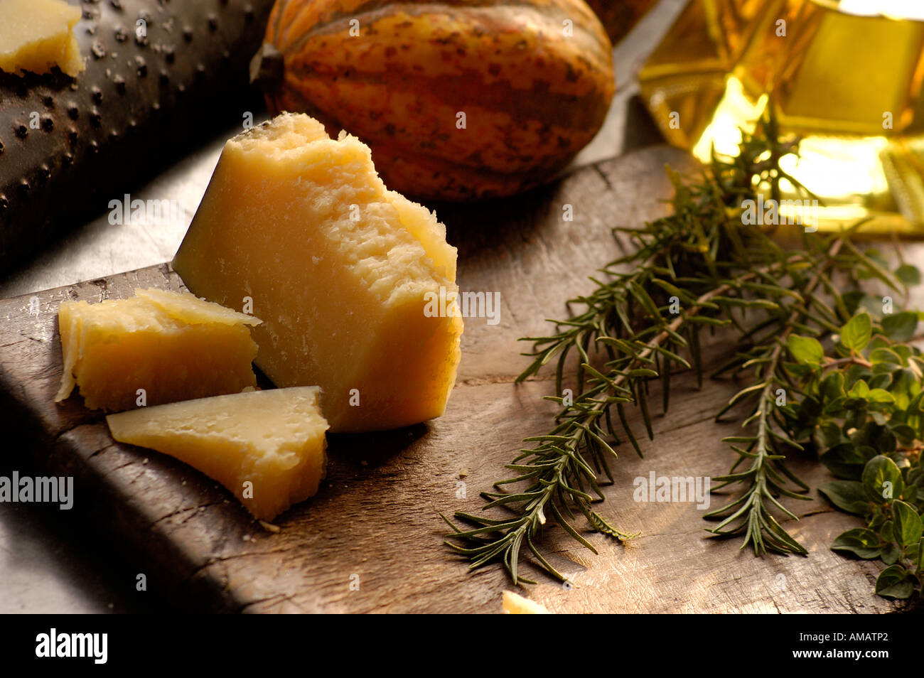 parmesan cheese, oil and fresh herbs on wood Stock Photo - Alamy