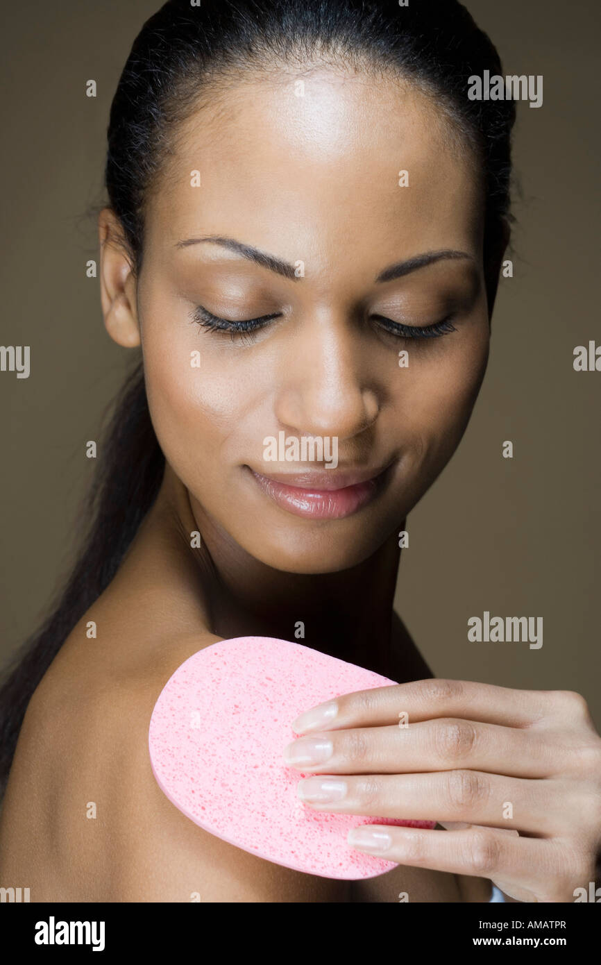 A woman exfoliating Stock Photo - Alamy