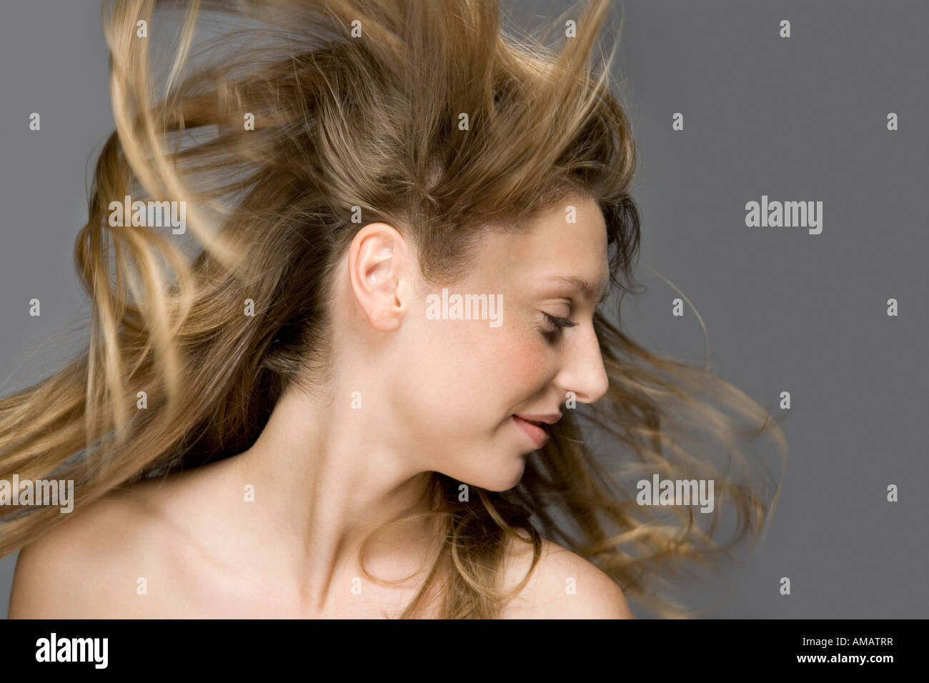 Air blowing through a fashion model's hair Stock Photo - Alamy