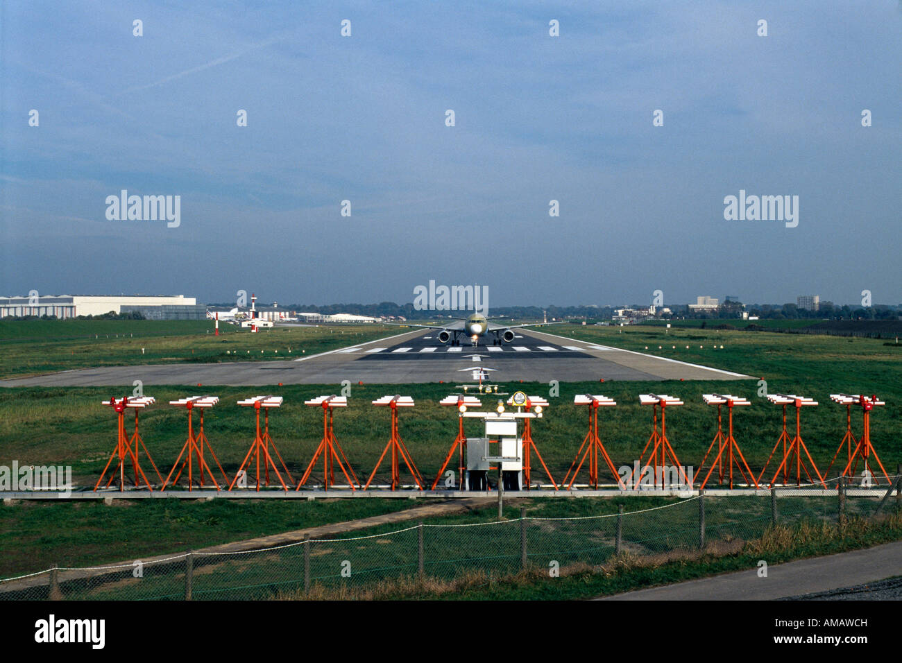 An aeroplane landing on a runway Stock Photo - Alamy