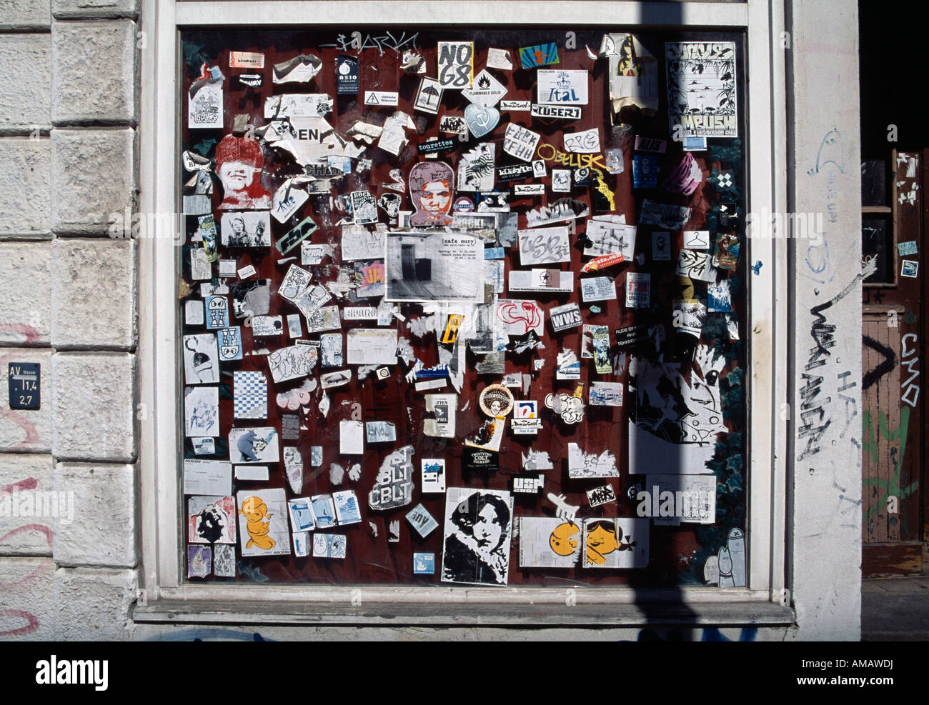 Stickers covering a window Stock Photo - Alamy