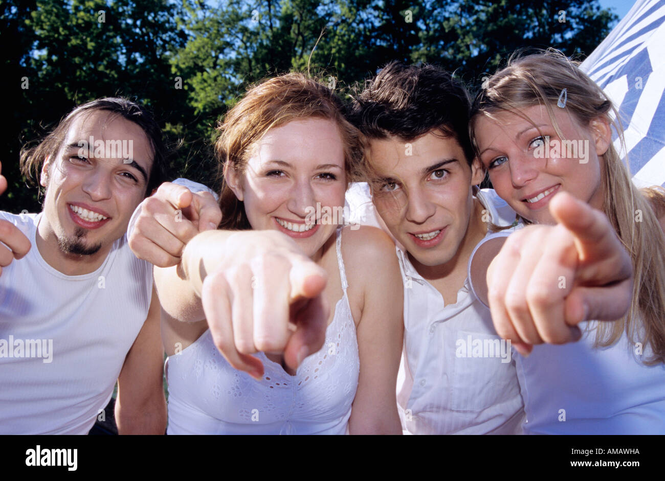 Four young people showing finger, close-up, portrait Stock Photo - Alamy