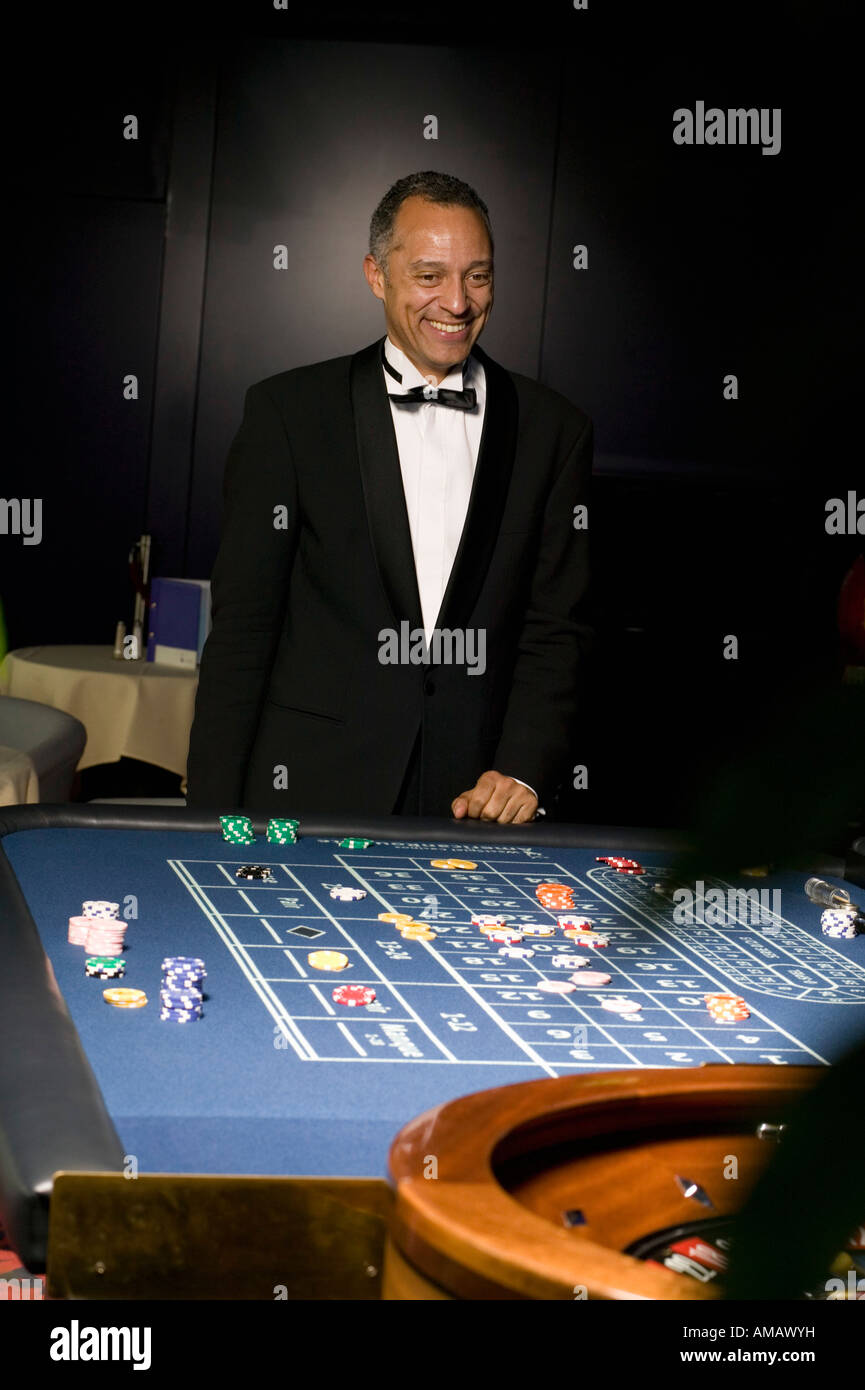 Man placing bet roulette table hi-res stock photography and images - Alamy