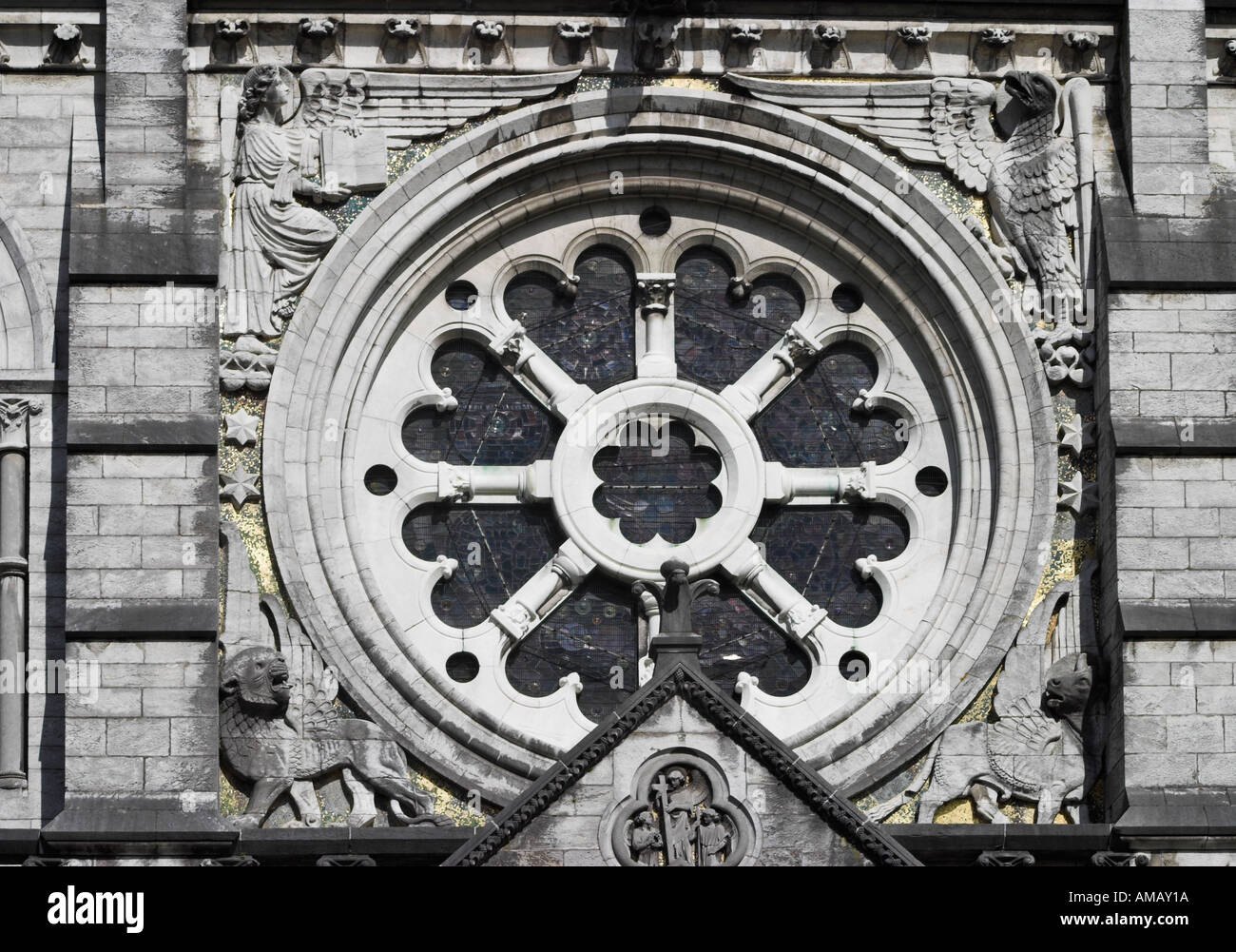 A rose window with the symbols of the four evangelists gospel writers ...