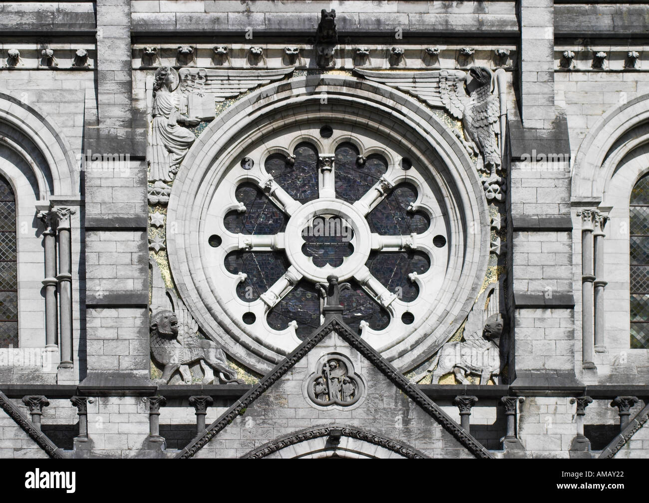 A rose window with the symbols of the four evangelists gospel writers ...
