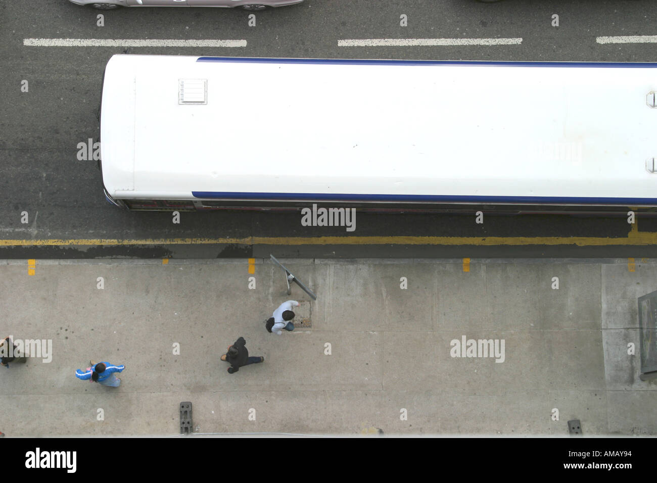 Overhead birds eye view of pedestrians and bus on city street Stock ...