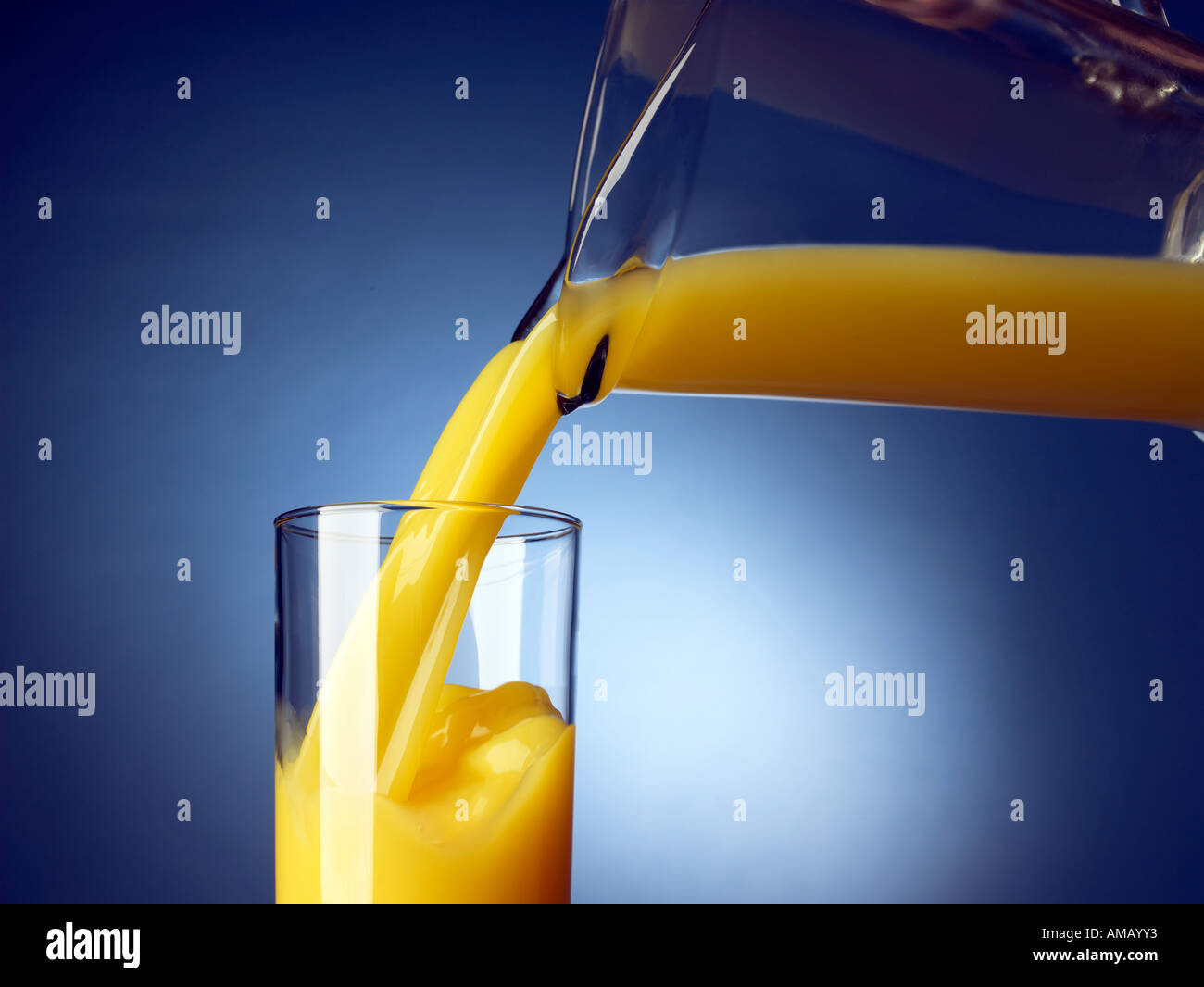 Pouring orange Juice horizontal Stock Photo - Alamy