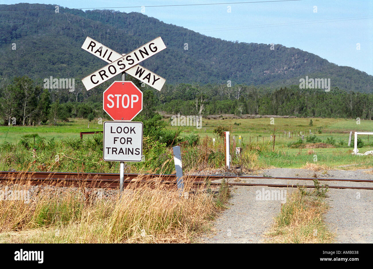 Stop sign at railway crossing in rural Australia Stock Photo - Alamy