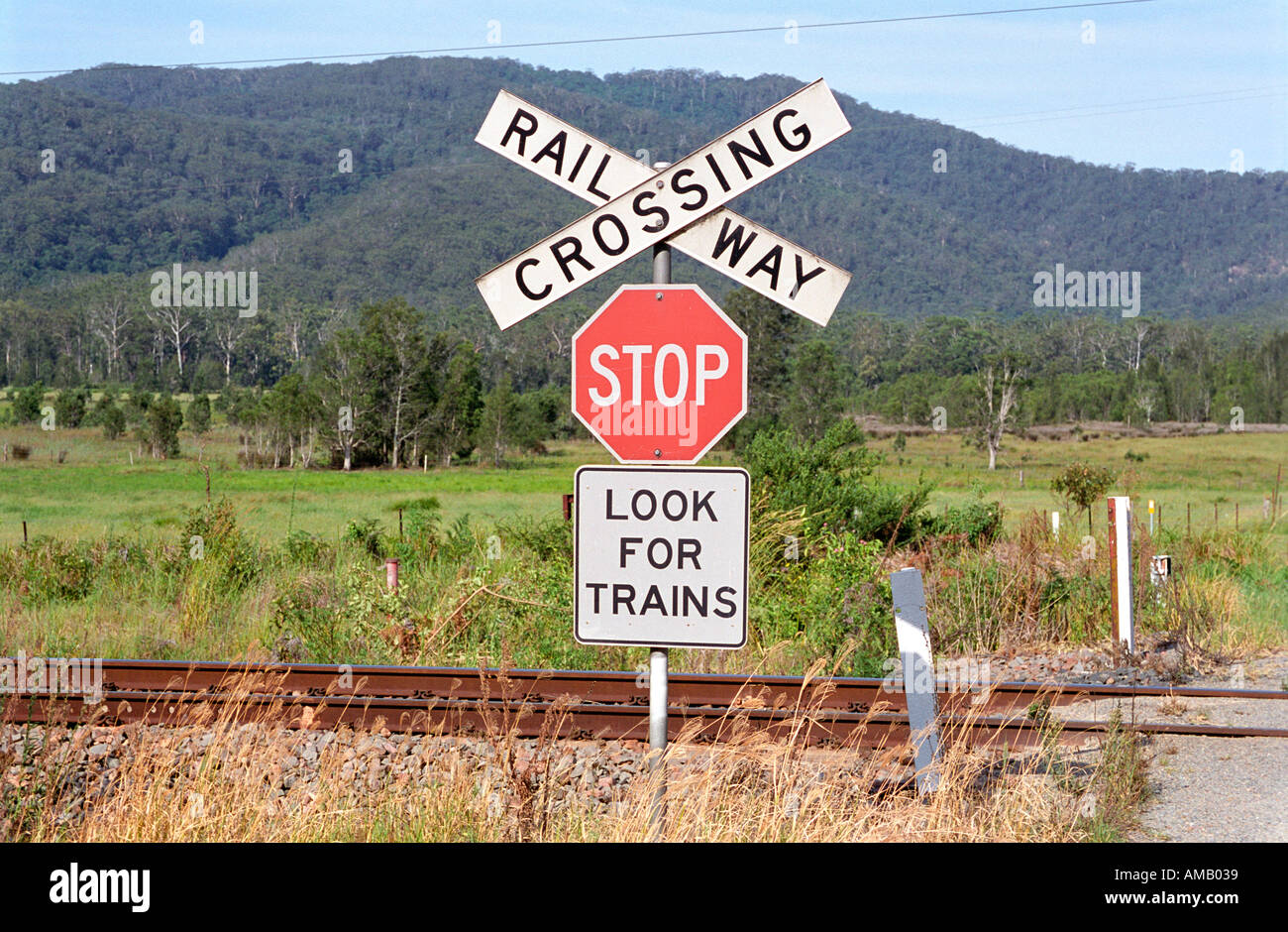 Stop sign at railway crossing in rural Australia Stock Photo - Alamy