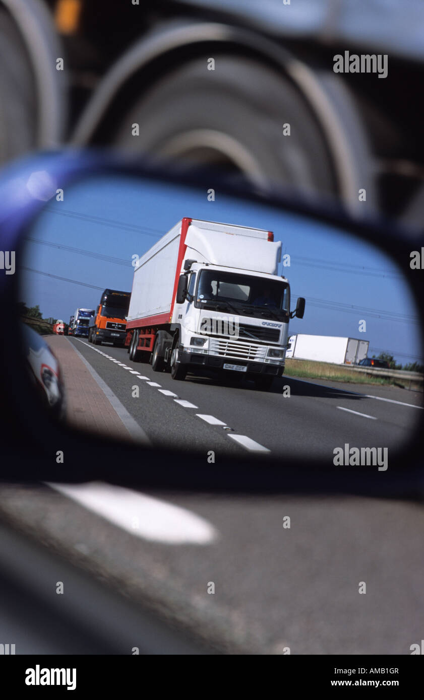 lorry travelling on the A1 M1 reflected in vehicle wing mirror Leeds UK ...