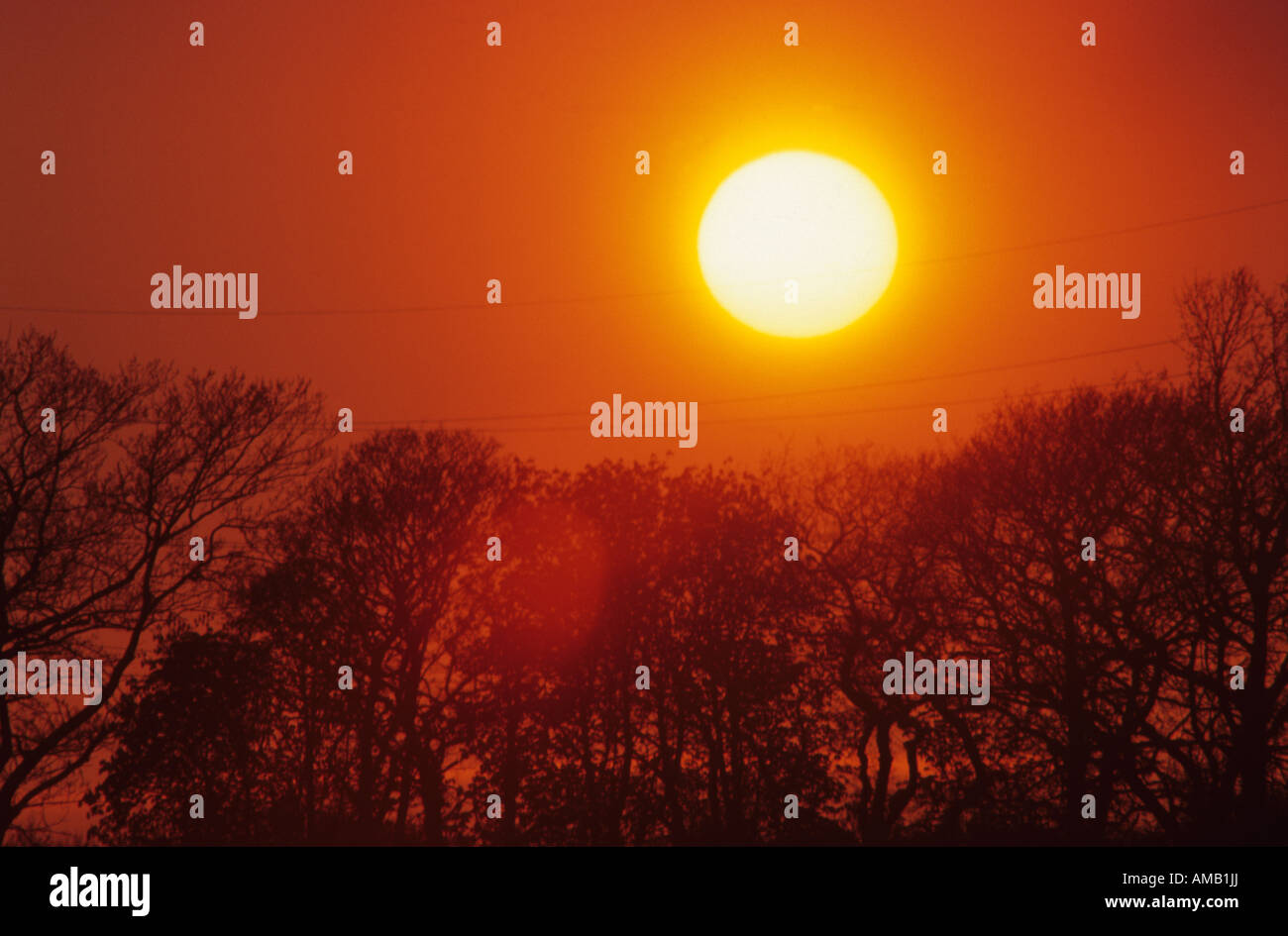 giant orange sun at sunset leeds yorkshire uk Stock Photo - Alamy