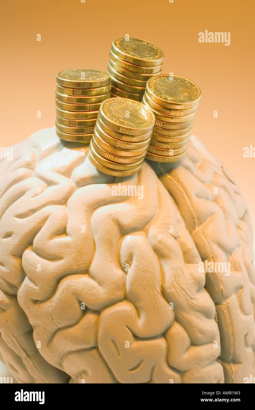 Human Brain with Stacks of Coins Stock Photo - Alamy