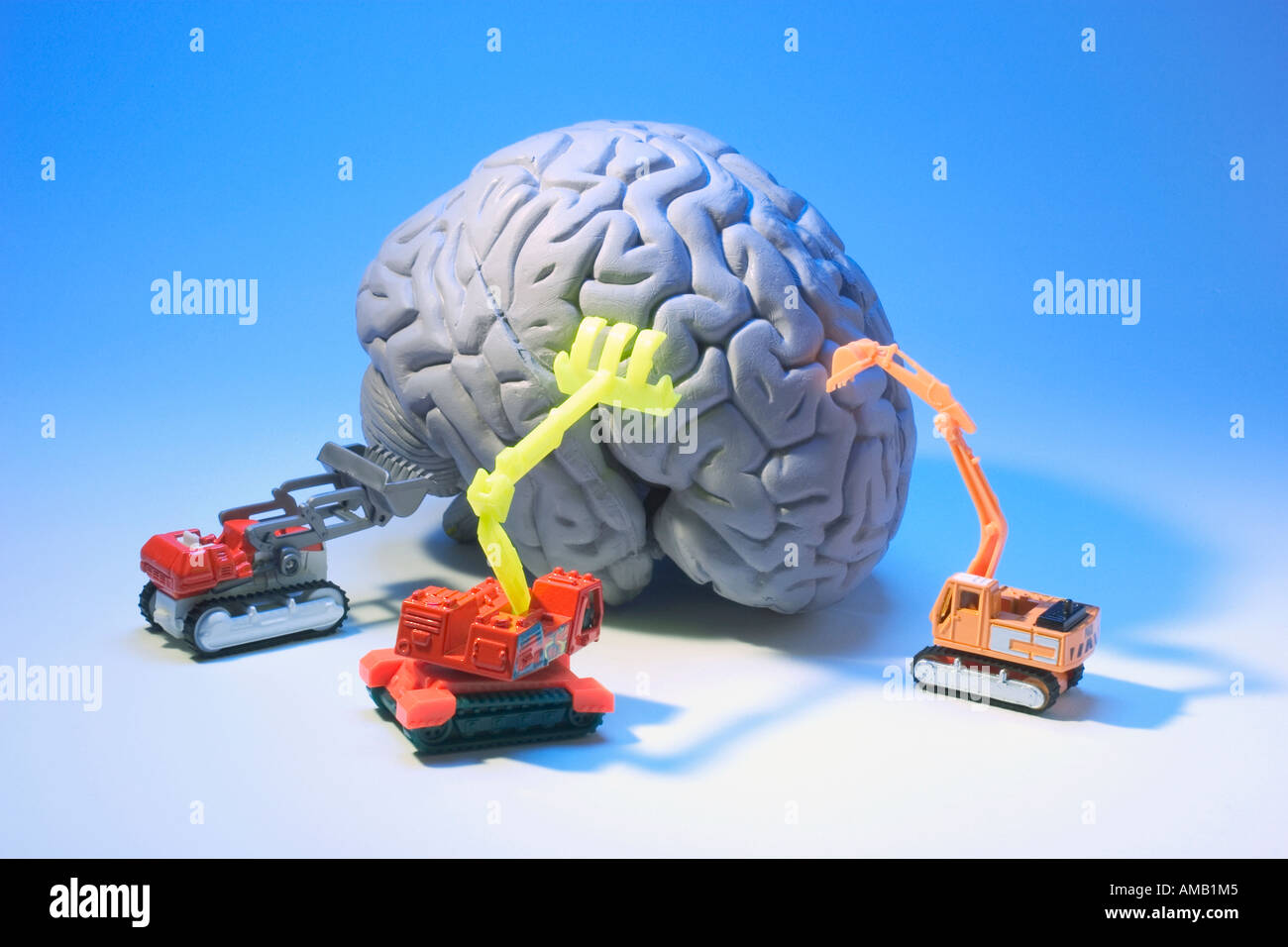 Human Brain and Miniature Farm Machines Stock Photo - Alamy