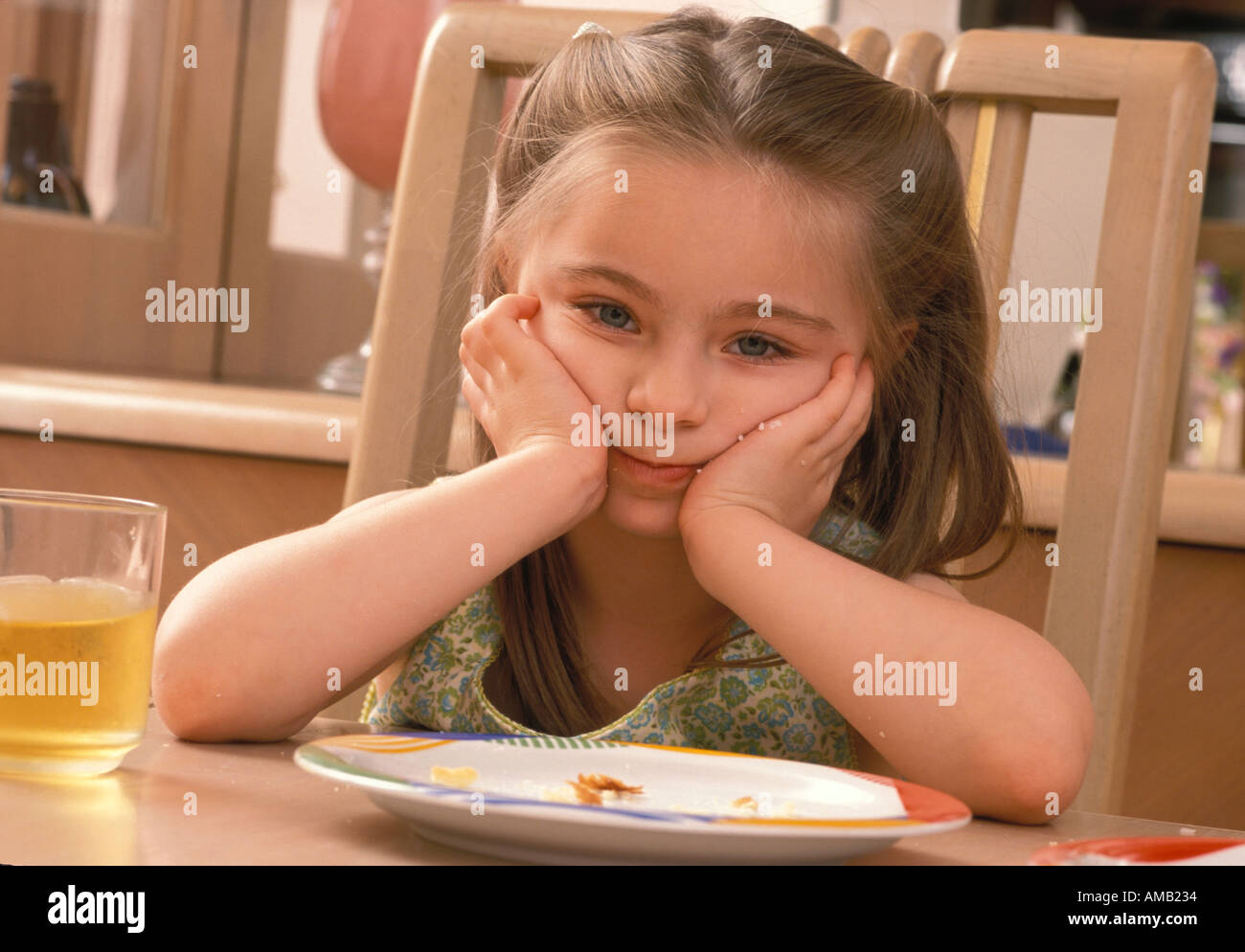 Child Girl after meal Stock Photo - Alamy