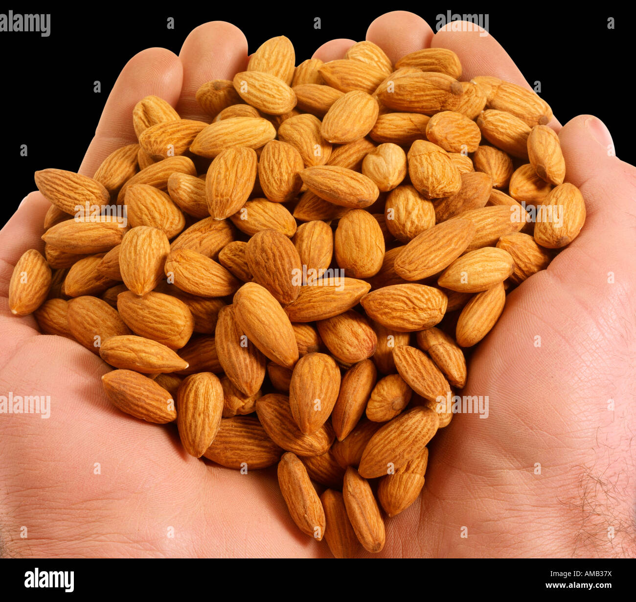 HANDFUL OF ALMONDS Stock Photo - Alamy