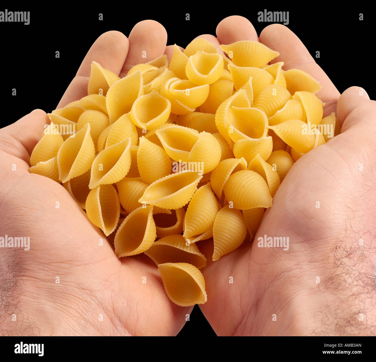 HANDFUL OF CONCHIGLIE PASTA Stock Photo - Alamy