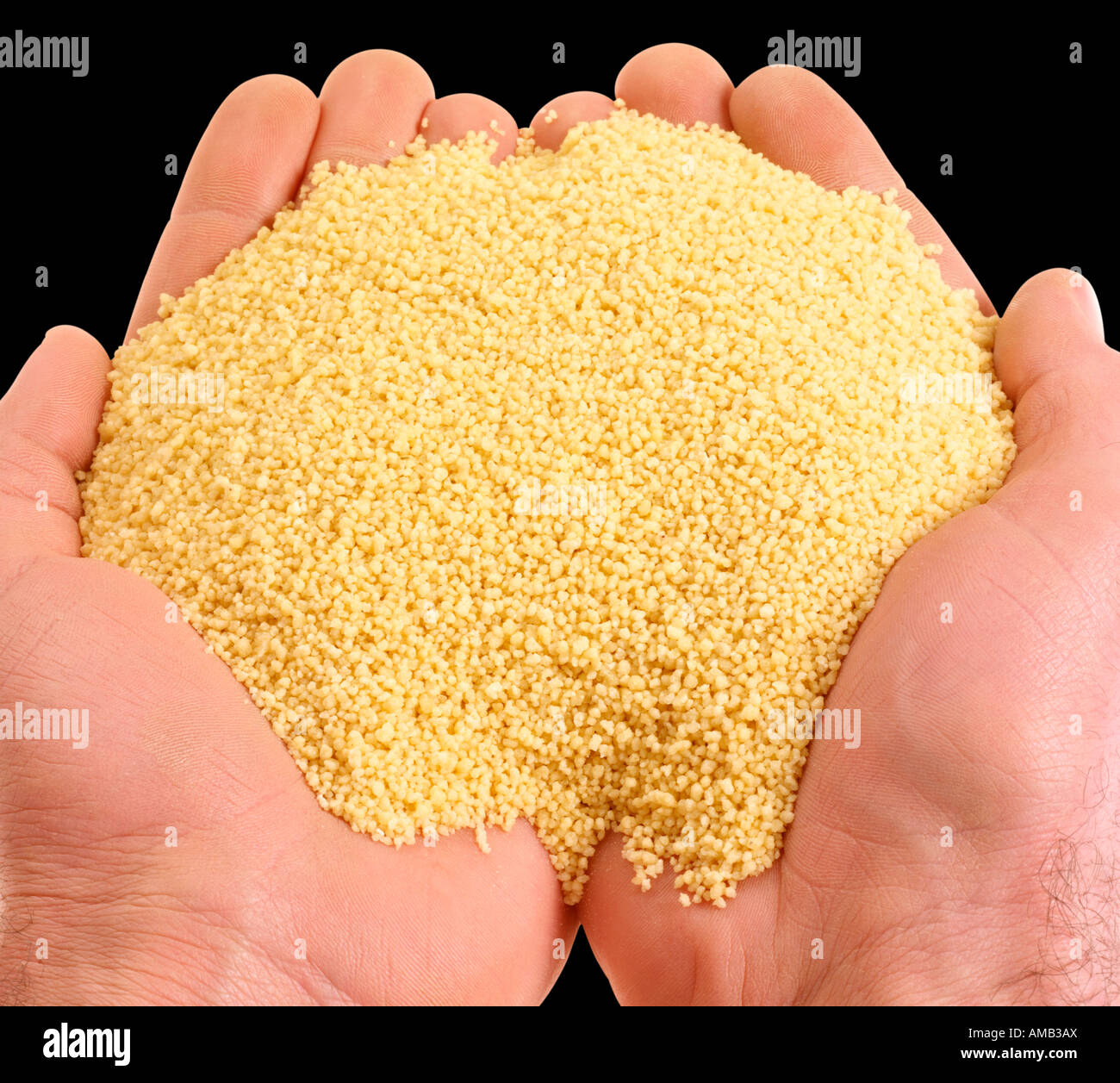 HANDFUL OF COUS COUS Stock Photo - Alamy