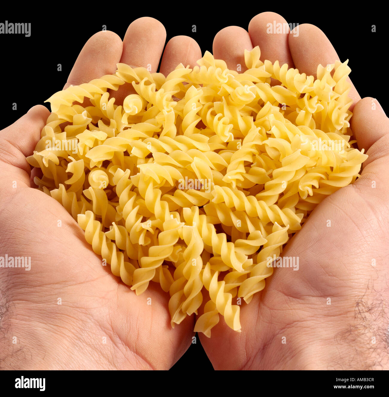 HANDFUL OF FUSILLI PASTA Stock Photo - Alamy