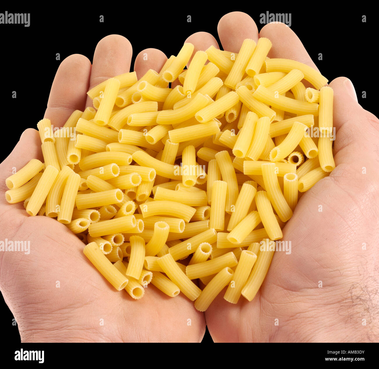 HANDFUL OF MACARONI PASTA Stock Photo - Alamy