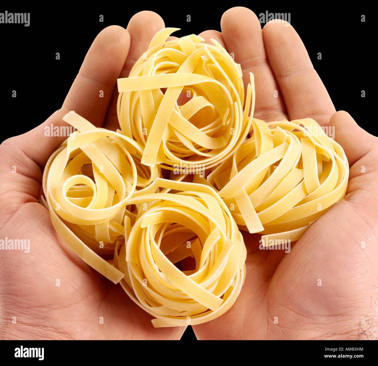 HANDFUL OF TAGLIATELLE PASTA Stock Photo - Alamy