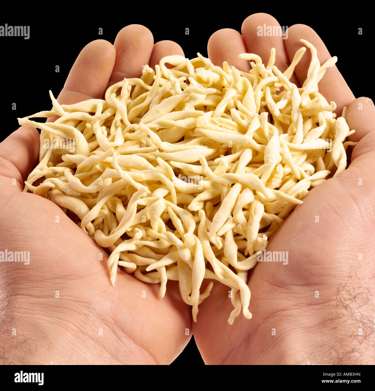 HANDFUL OF TROFIE PASTA Stock Photo - Alamy