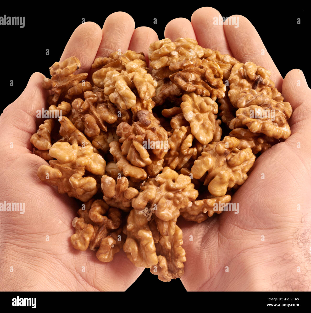 HANDFUL OF WALNUTS Stock Photo - Alamy