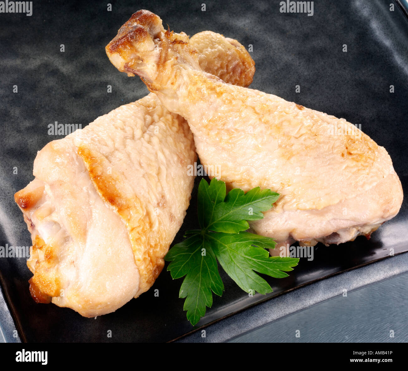 Two roasted chicken legs hi-res stock photography and images - Alamy