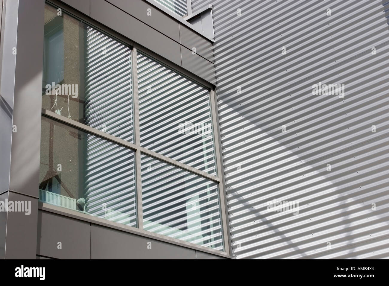 Grey wall with horizontal lines light reflecting from window background ...