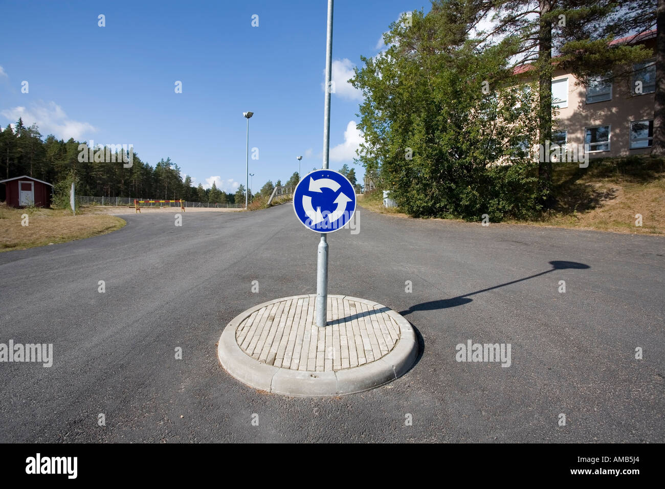 compulsory roundabout traffic sign Stock Photo - Alamy