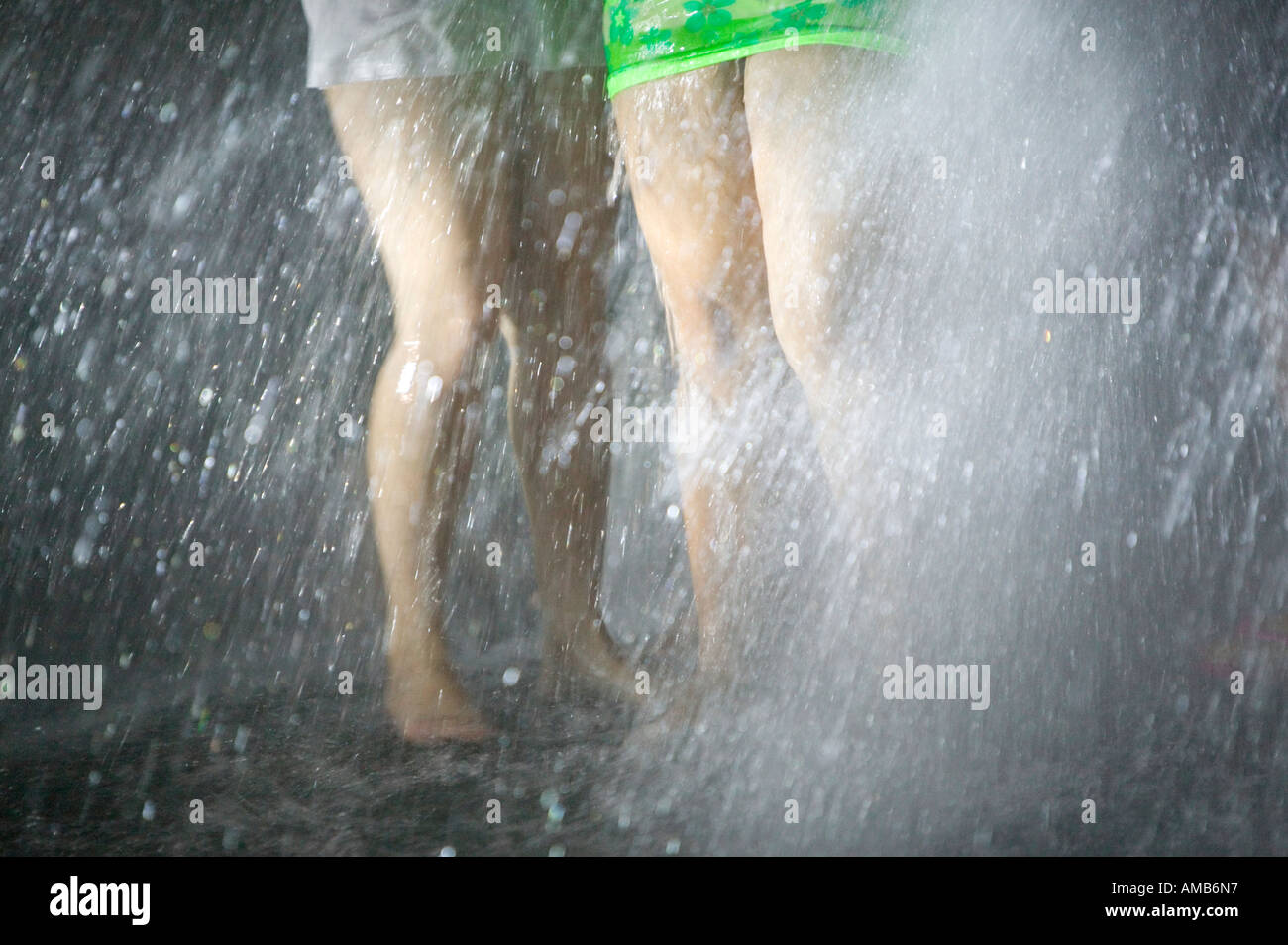Playing in the fire hydrant spray in Harlem New York City USA August ...