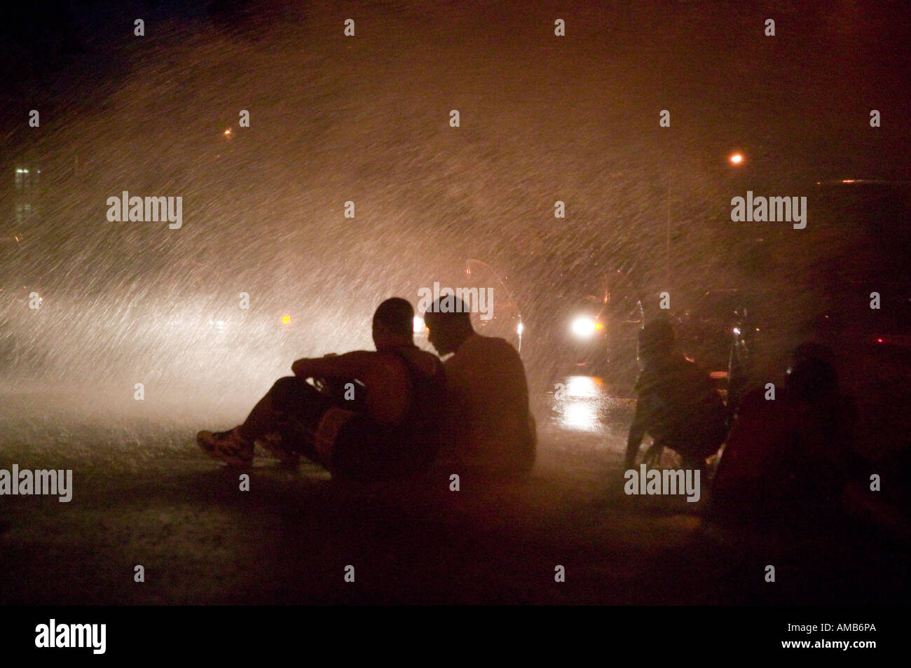 Playing in the fire hydrant spray in Harlem New York City USA August ...