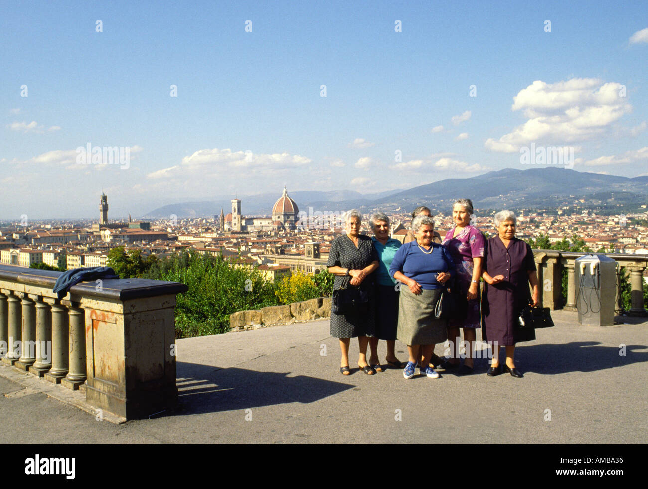 Florence. Italian women pose on the Piazzale Michelangelo. The Duomo ...