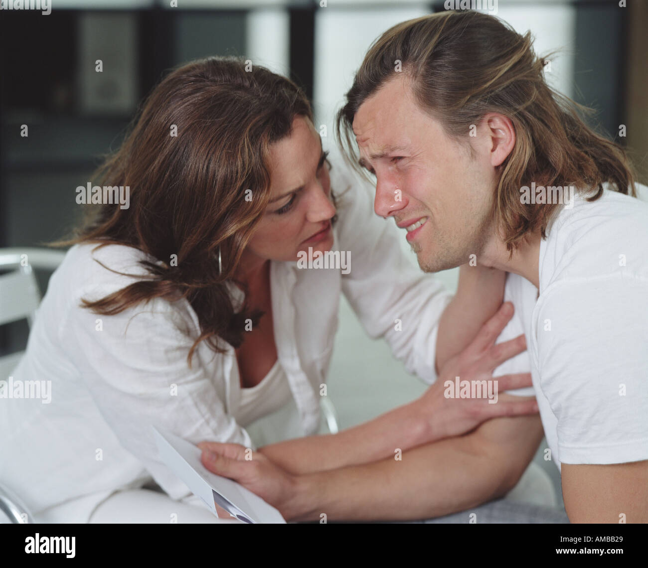 Crying man with women comfort hi-res stock photography and images - Alamy