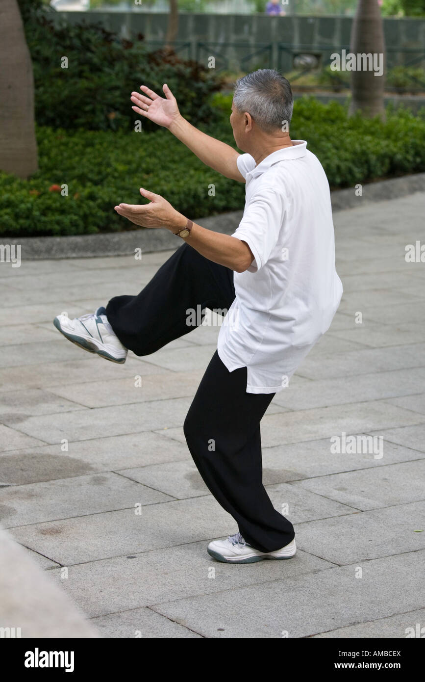 A man practices tai chi on his own early in the morning in Chater ...